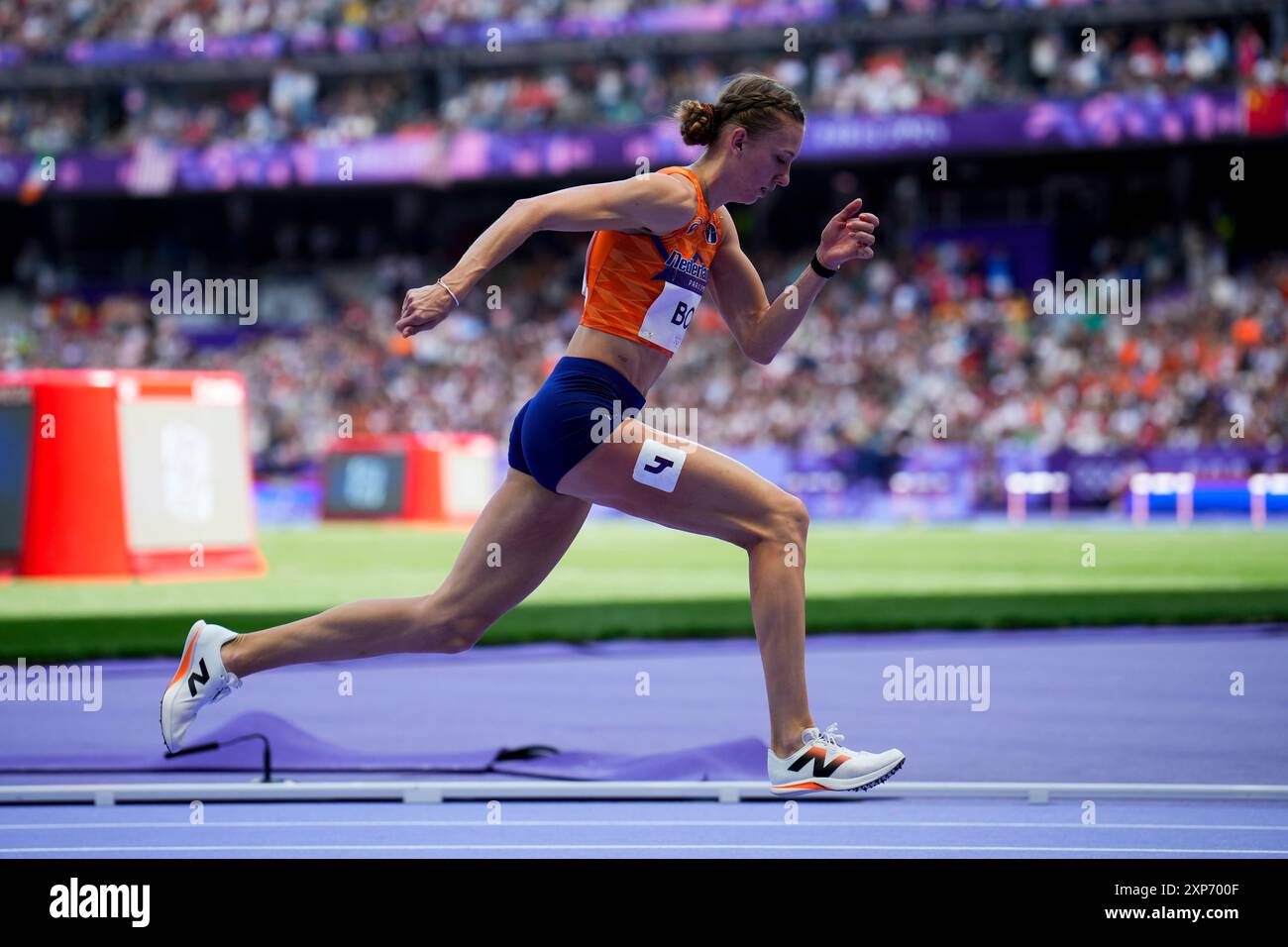 Femke Bol, of the Netherlands, competes during a heat in the women's ...