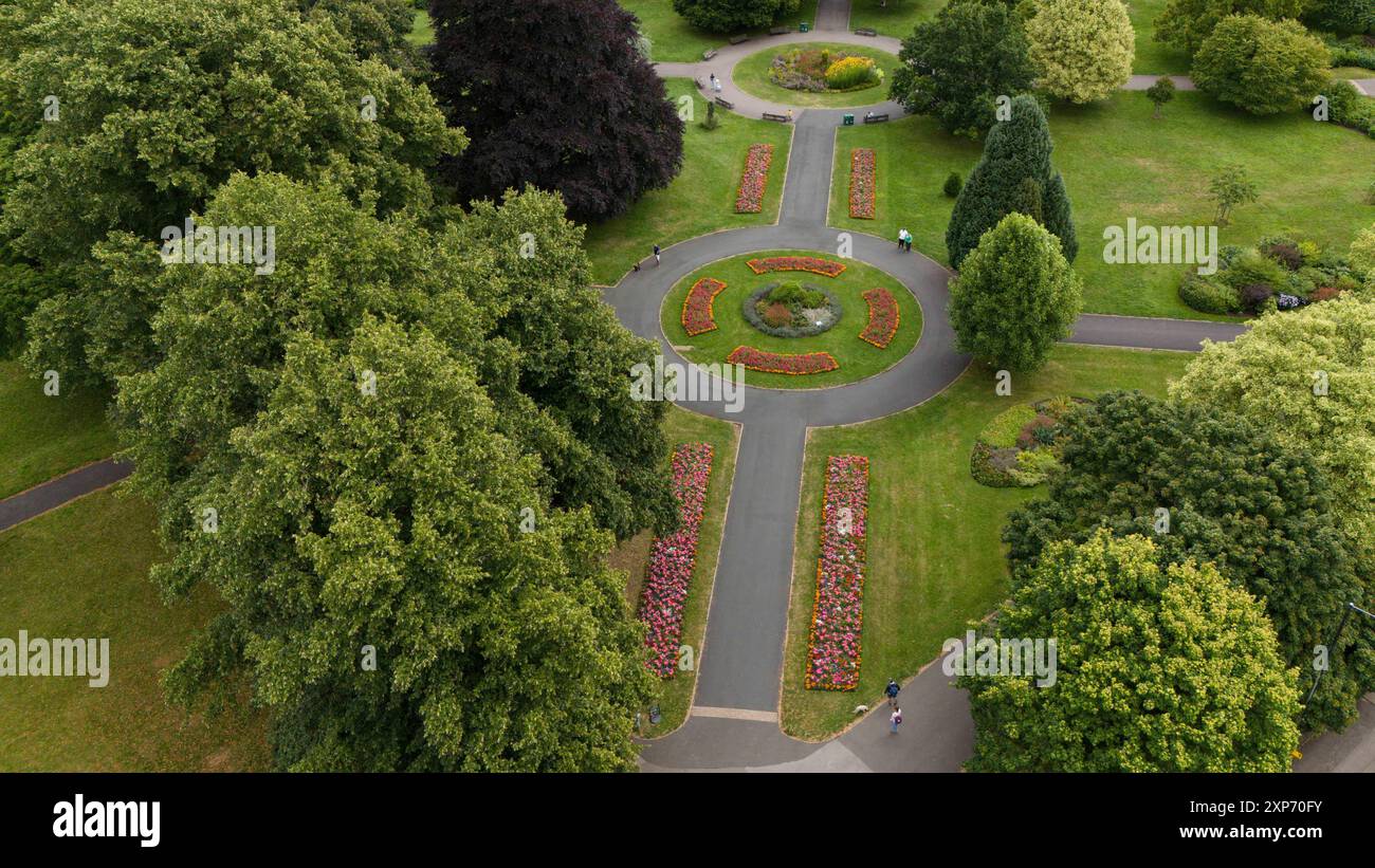 Visitors walk around the gardens of St Nicholas' park in Warwick ...