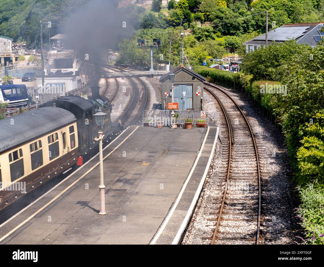 Steam train pulling away from Kingswear station on the Dartmouth Steam ...