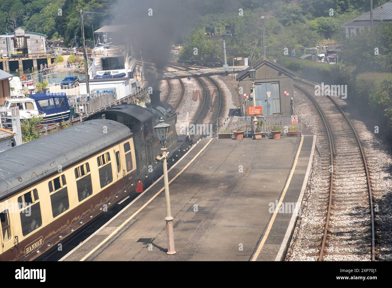 Steam train pulling away from Kingswear station on the Dartmouth Steam ...