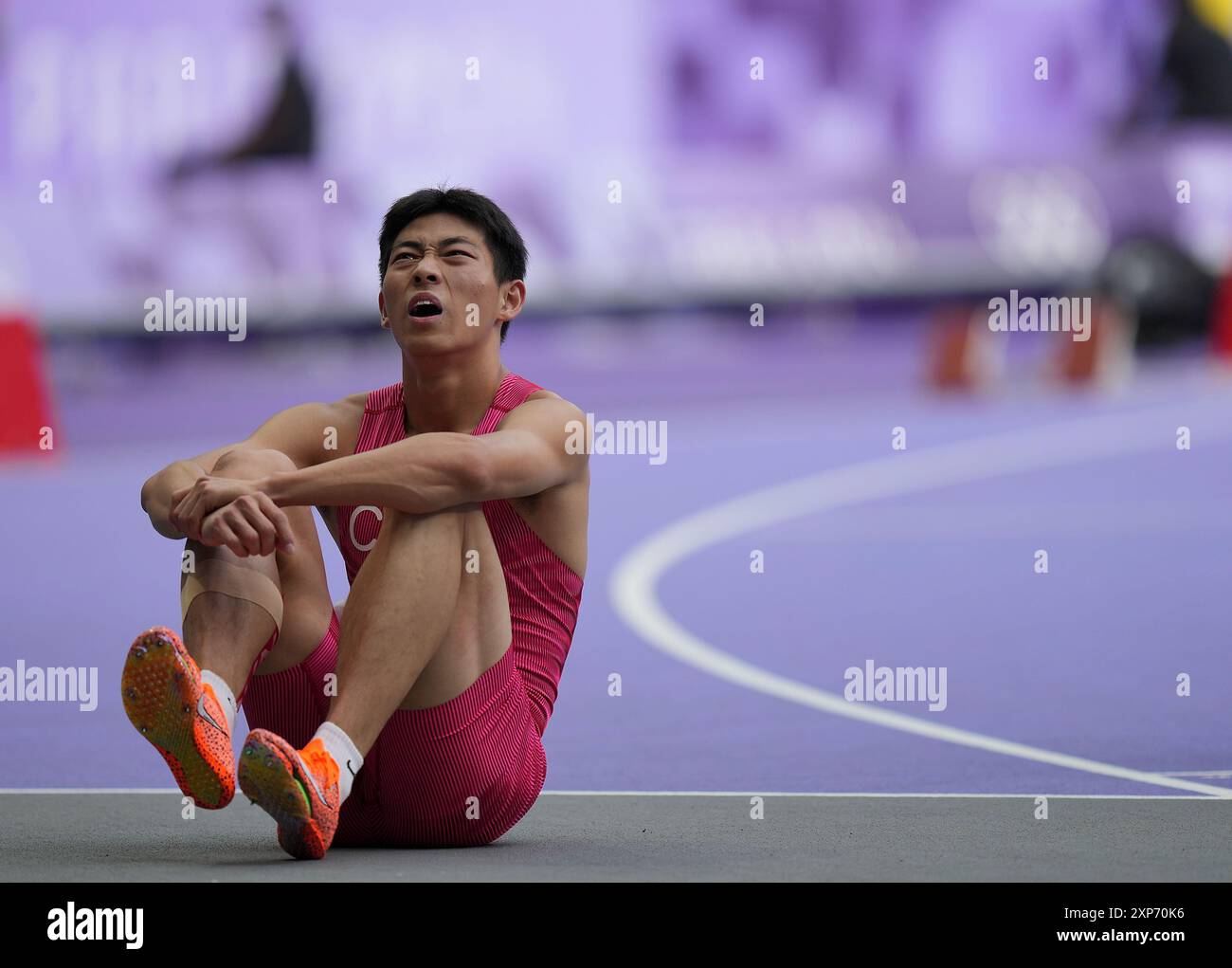 Paris, France. 4th Aug, 2024. Liu Junxi of China reacts after the men's 110m hurdles round 1 of ...
