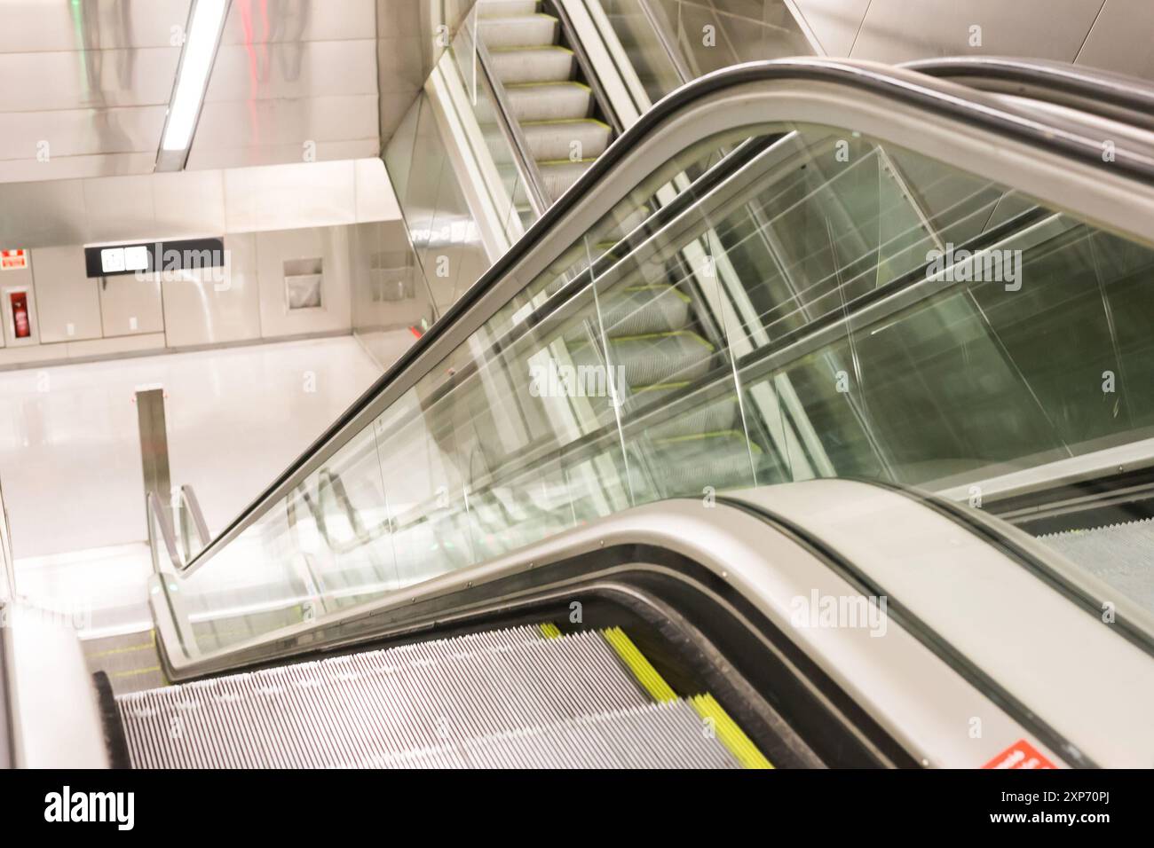 Line escalators with metal coating Stock Photo - Alamy