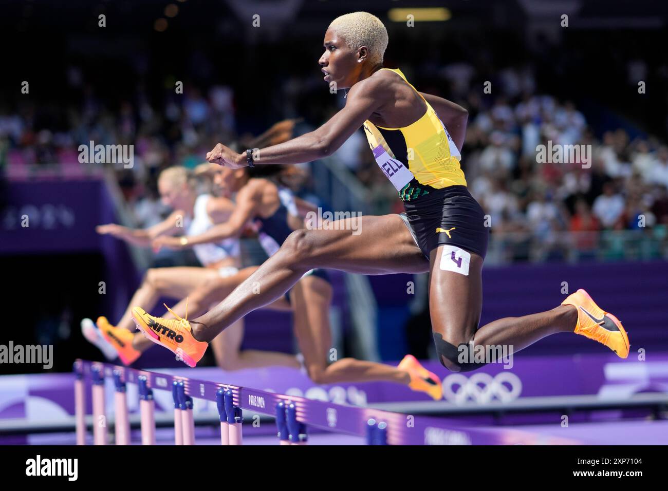 Janieve Russell, of Jamaica, competes in the women's 400-meter hurdles ...