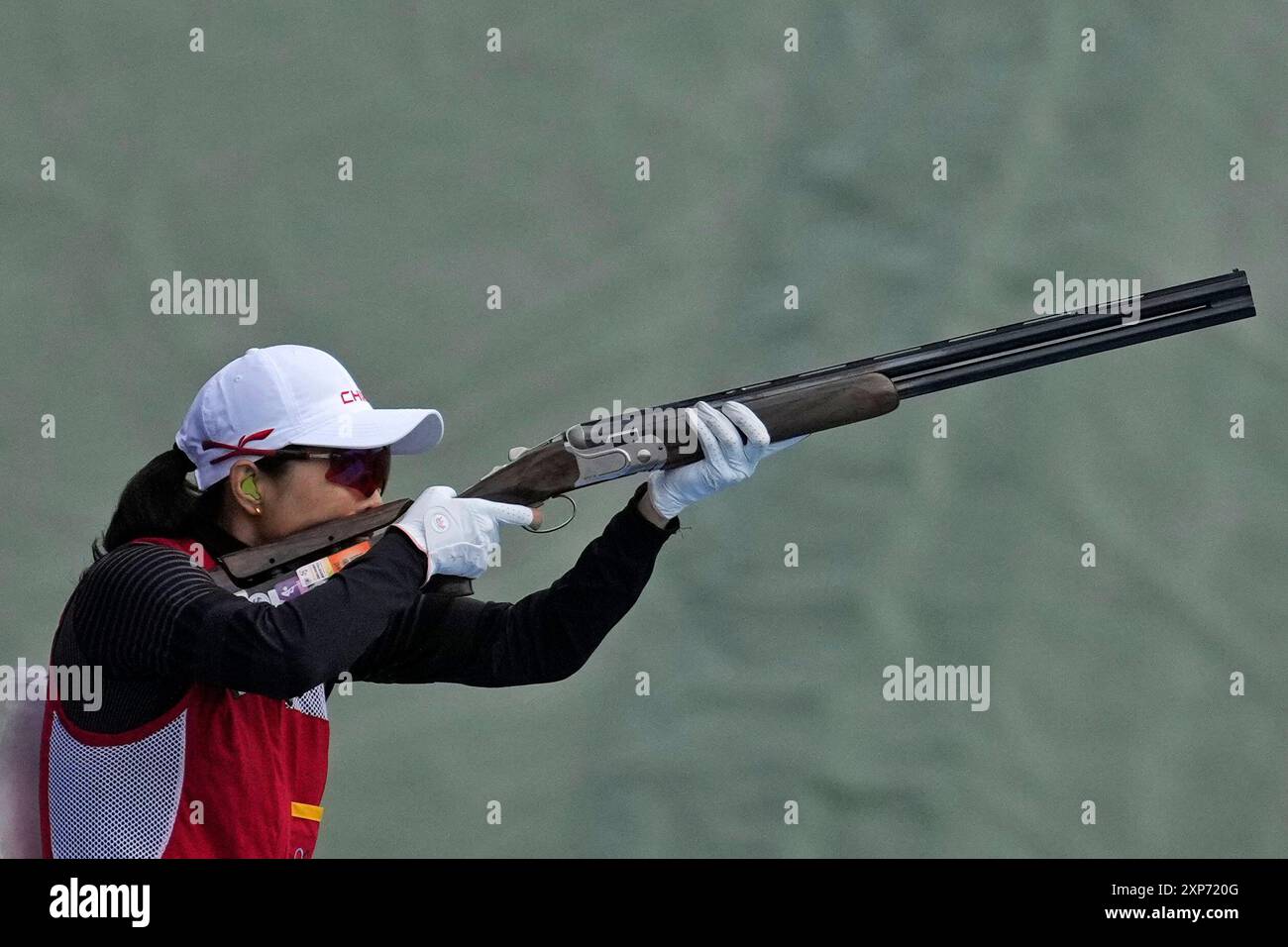 China's Wei Meng competes in the Skeet women's qualification round at ...