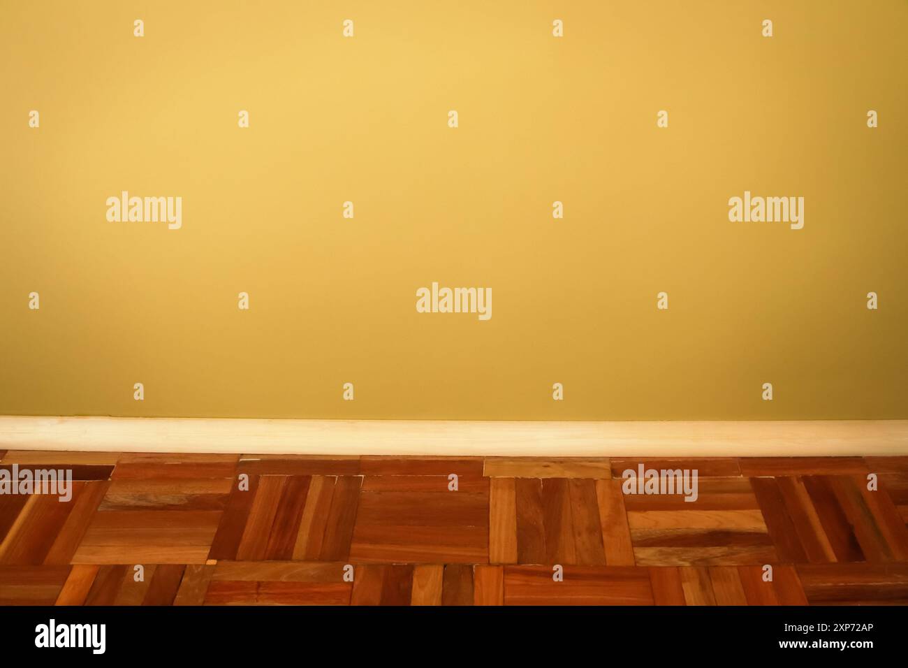 wall design with wooden parquet and olive-colored plinth. elegant wall ...