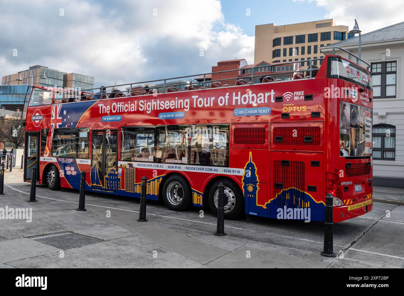 A tourist-sightseeing double-decker that goes around the local main ...