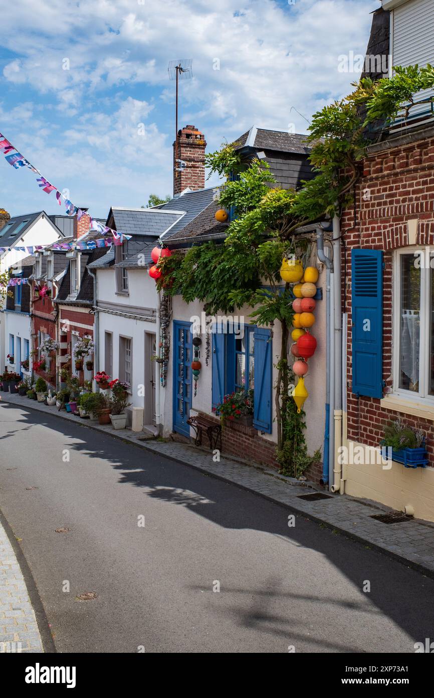 Picturesque cottages with vibrant flower displays outside in Saint ...