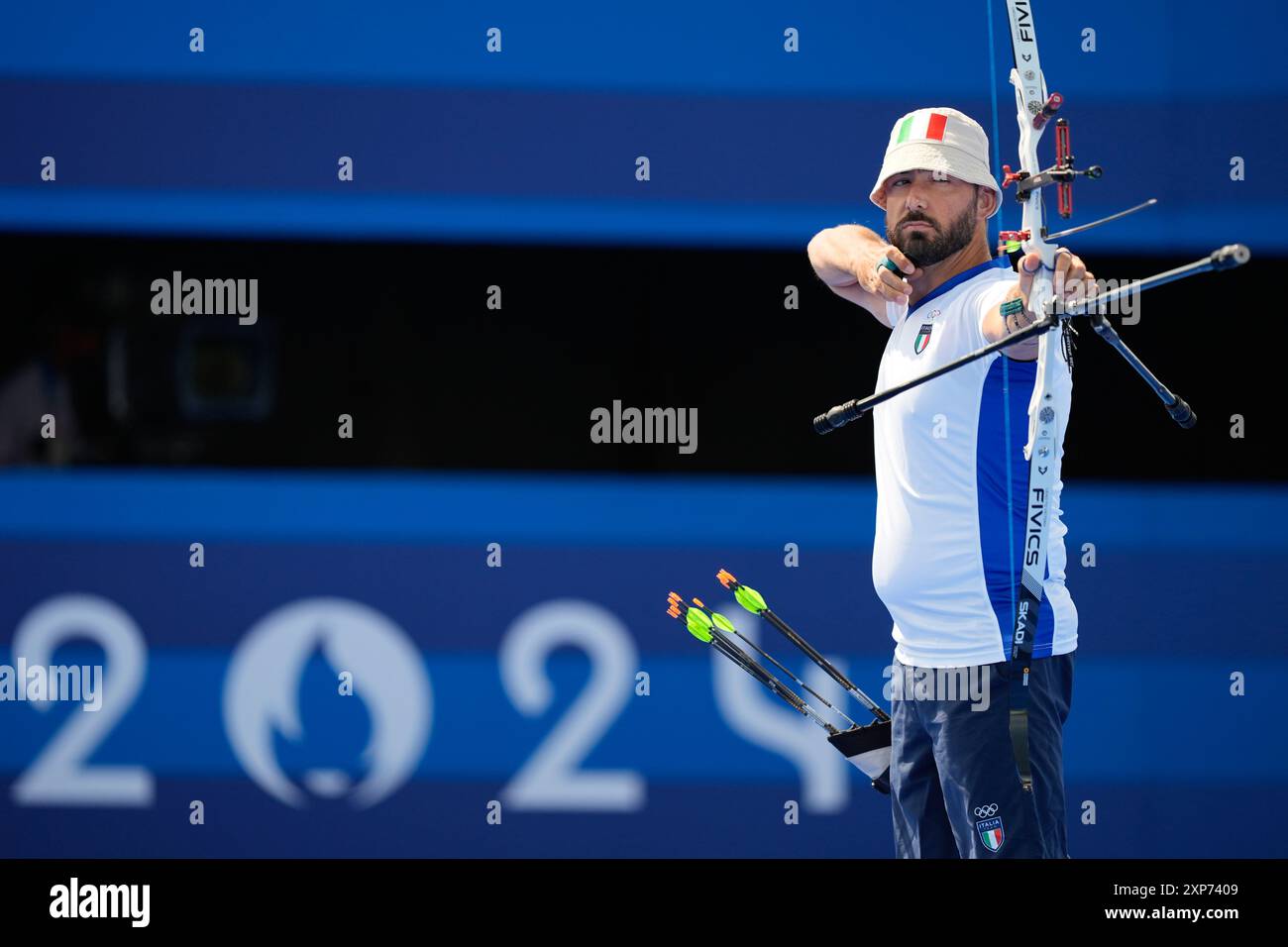 Italy's Mauro Nespoli releases his arrow in his men's quarterfinal ...
