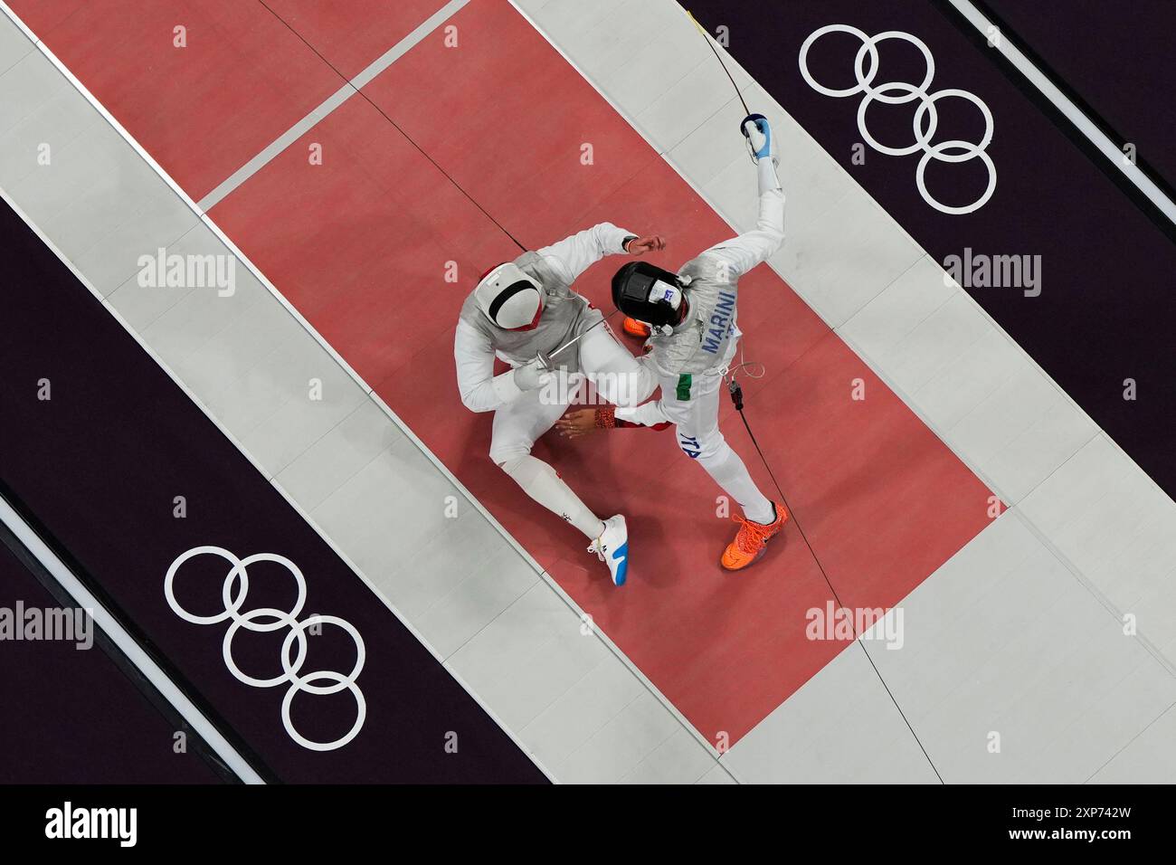 Italy's Tommaso Marini, right, and Poland's Michal Siess compete in the ...