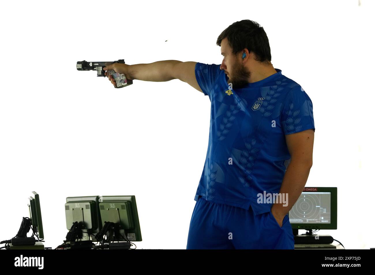 Ukraine's Pavlov Korostylov competes during the 25m rapid fire pistol ...