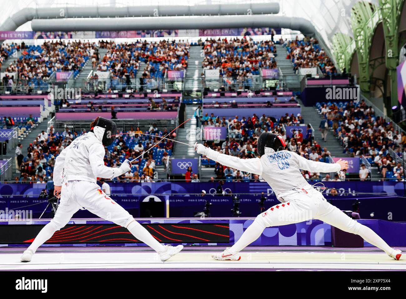 Jie Xu of China and Blake Broszus of Canada competes during Men's Foil ...