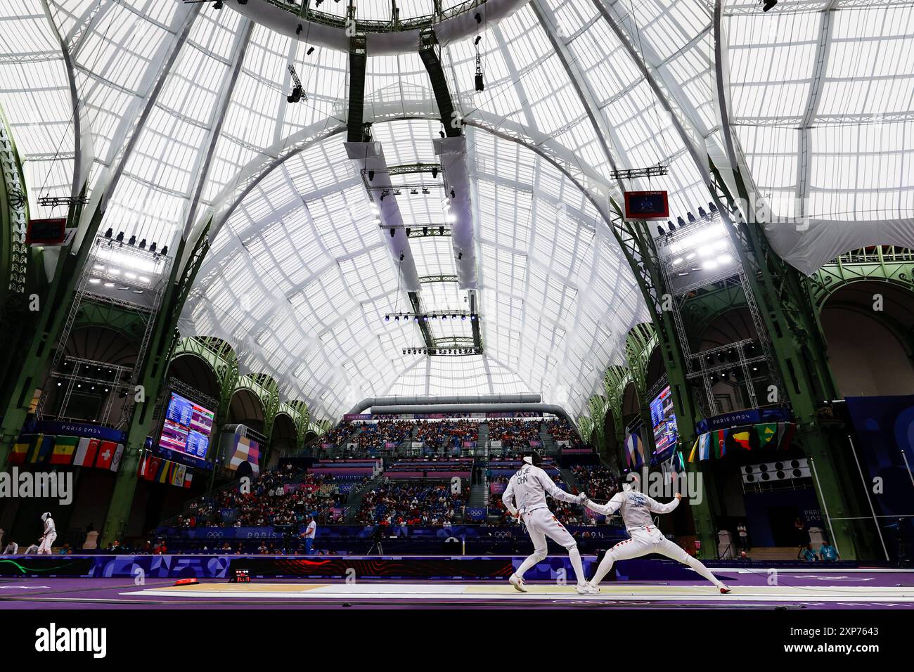 Jie Xu of China and Blake Broszus of Canada competes during Men's Foil ...