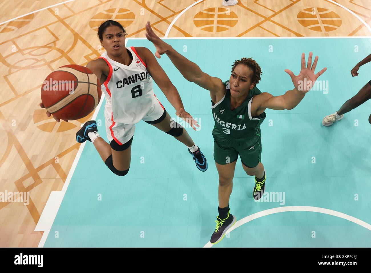 Cassandre Prosper (8), of Canada, shoots over Pallas Kunayi Akpanah (3 ...