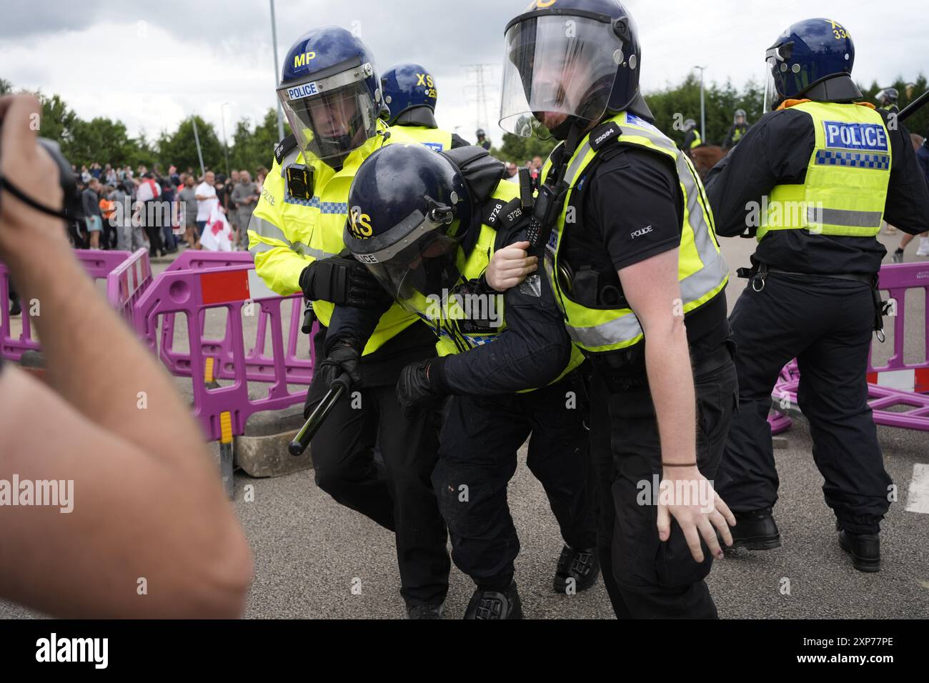 A police officers is injured as trouble flares during an anti ...