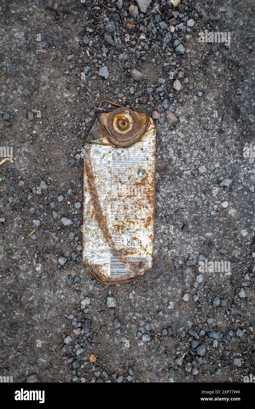 Crumpled squashed can on ground Stock Photo - Alamy