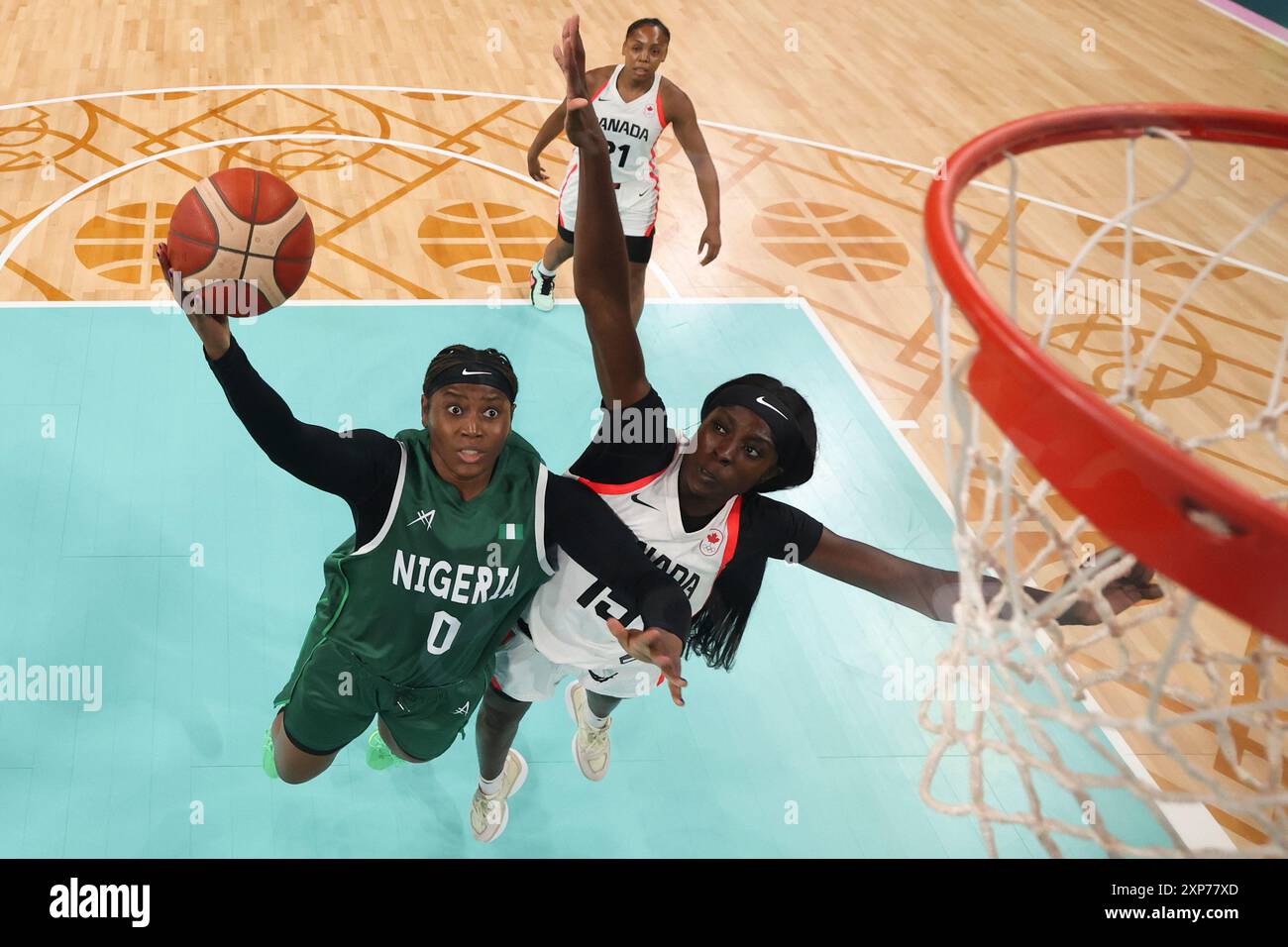 Amy Okonkwo (0), of Nigeria, shoots over Laeticia Amihere (15), of ...