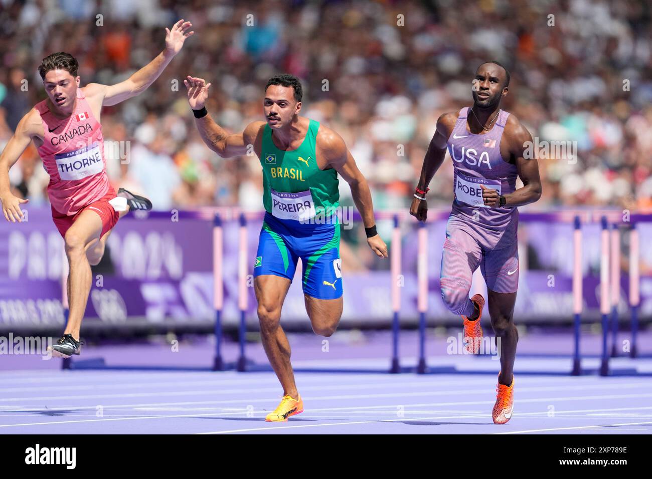 Daniel Roberts, of the United States, Rafael Pereira, of Brazil, and ...