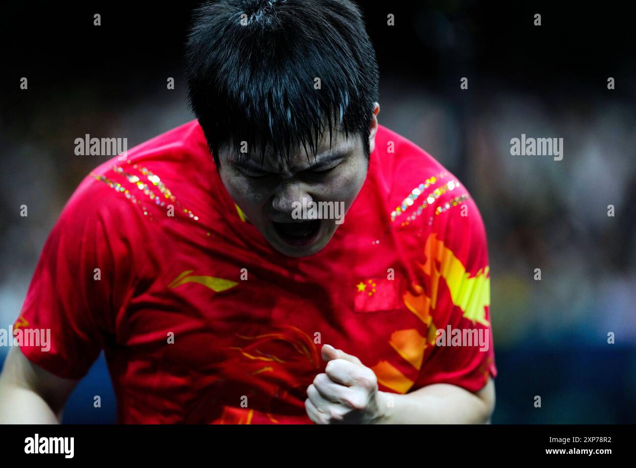 China's Fan Zhendong reacts after a winning point against Sweden's ...