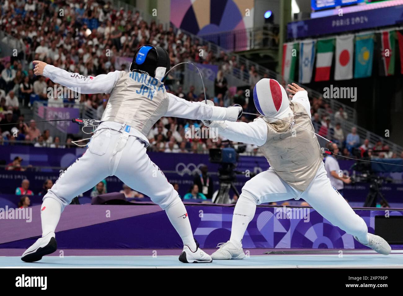 Japan's Kyosuke Matsuyama competes with France's Maximilien Chastanet ...