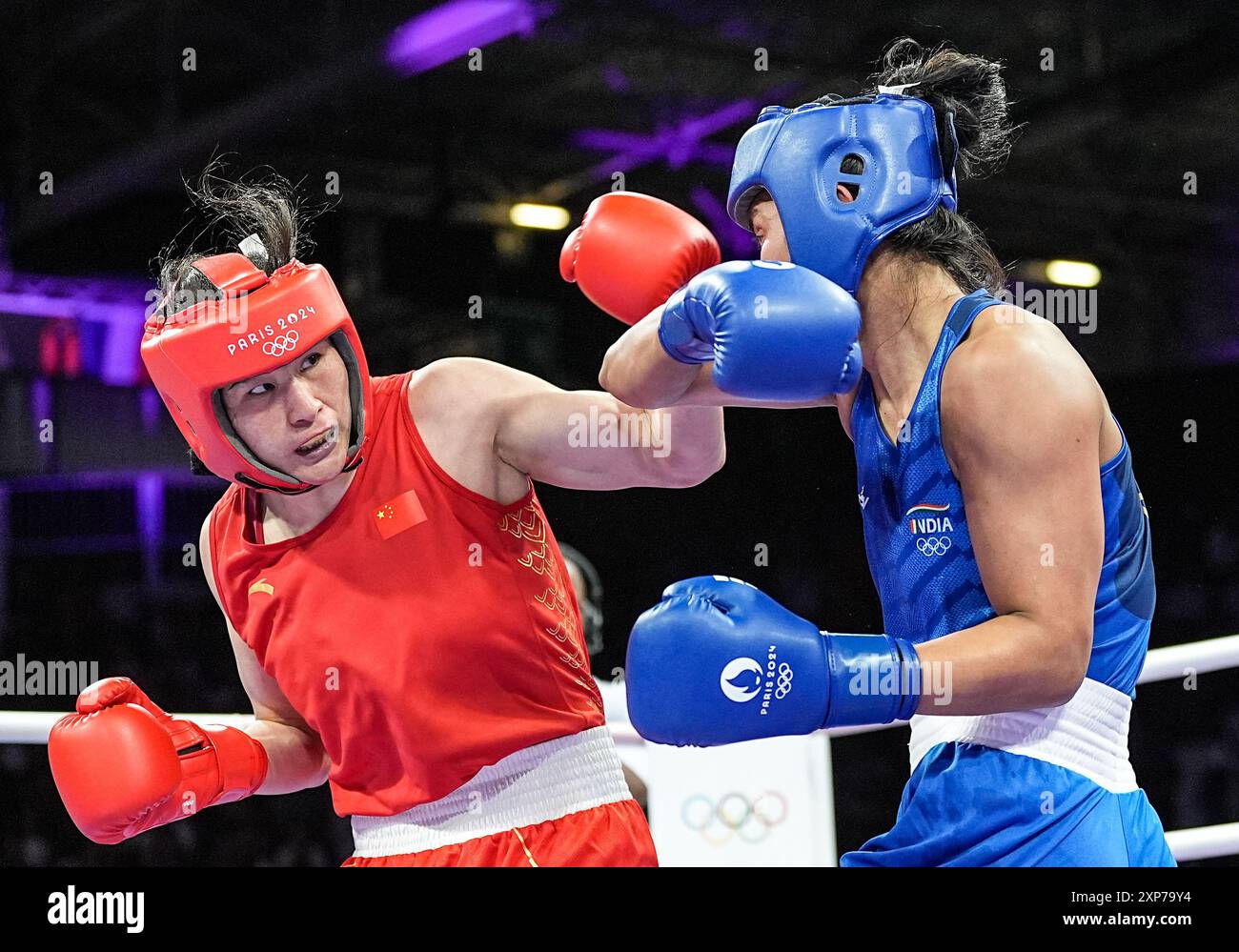 Paris, France. 4th Aug, 2024. Li Qian (L) of China competes with ...