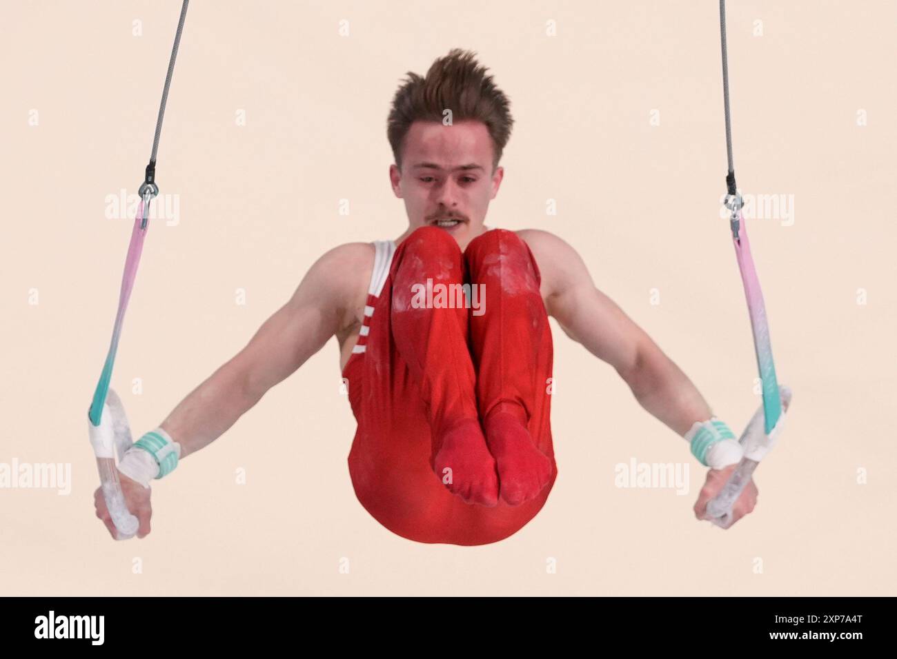 Glen Cuyle, of Belgium, performs on the rings during the men's artistic ...