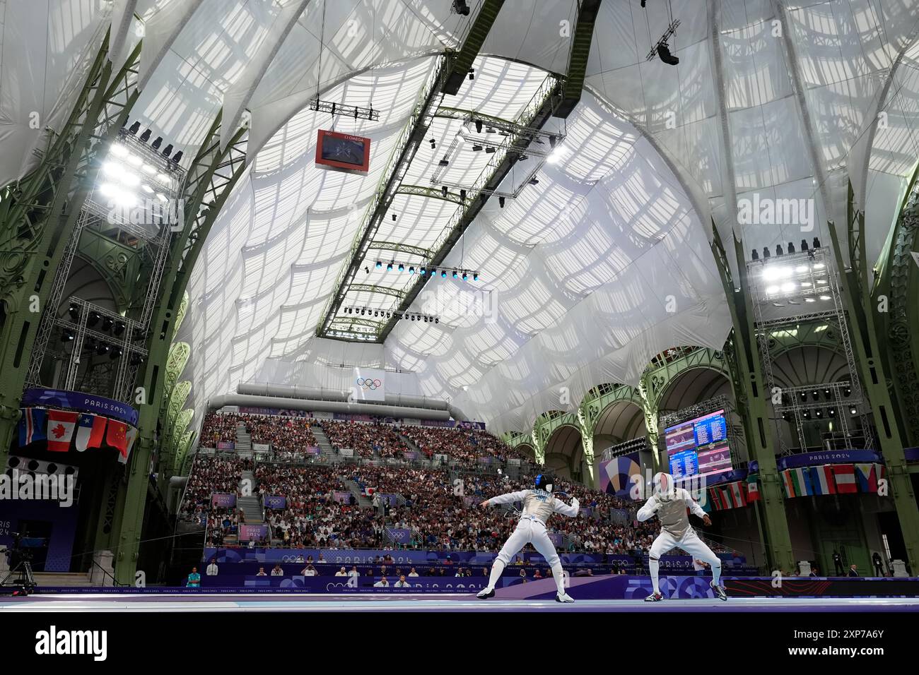 Japan's Kazuki Iimura competes with France's Maxime Pauty in the men's ...
