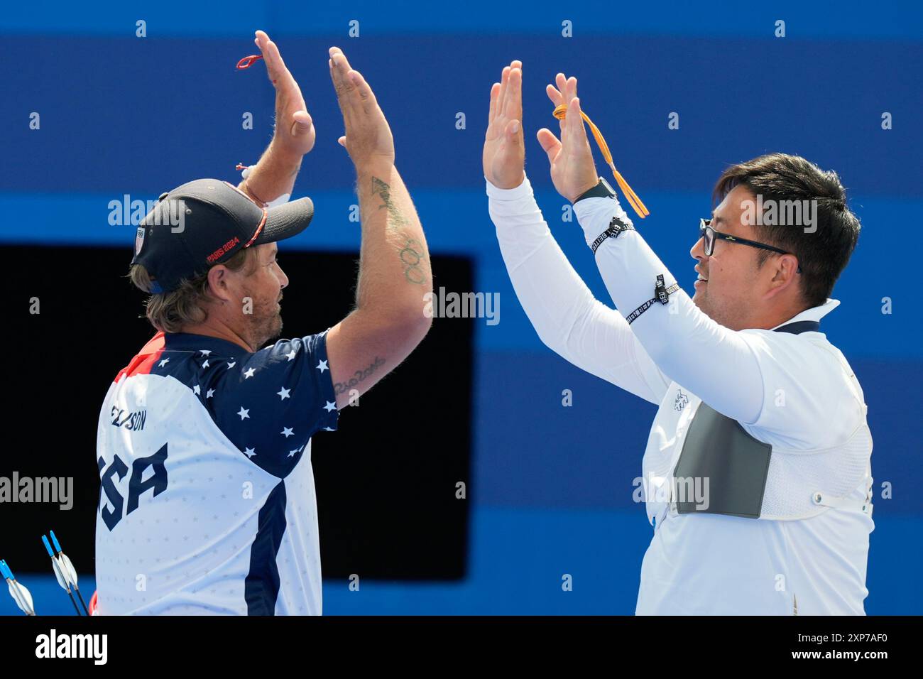 Gold medalist South Korea's Kim Woo-jin, right, celebrates with silver ...