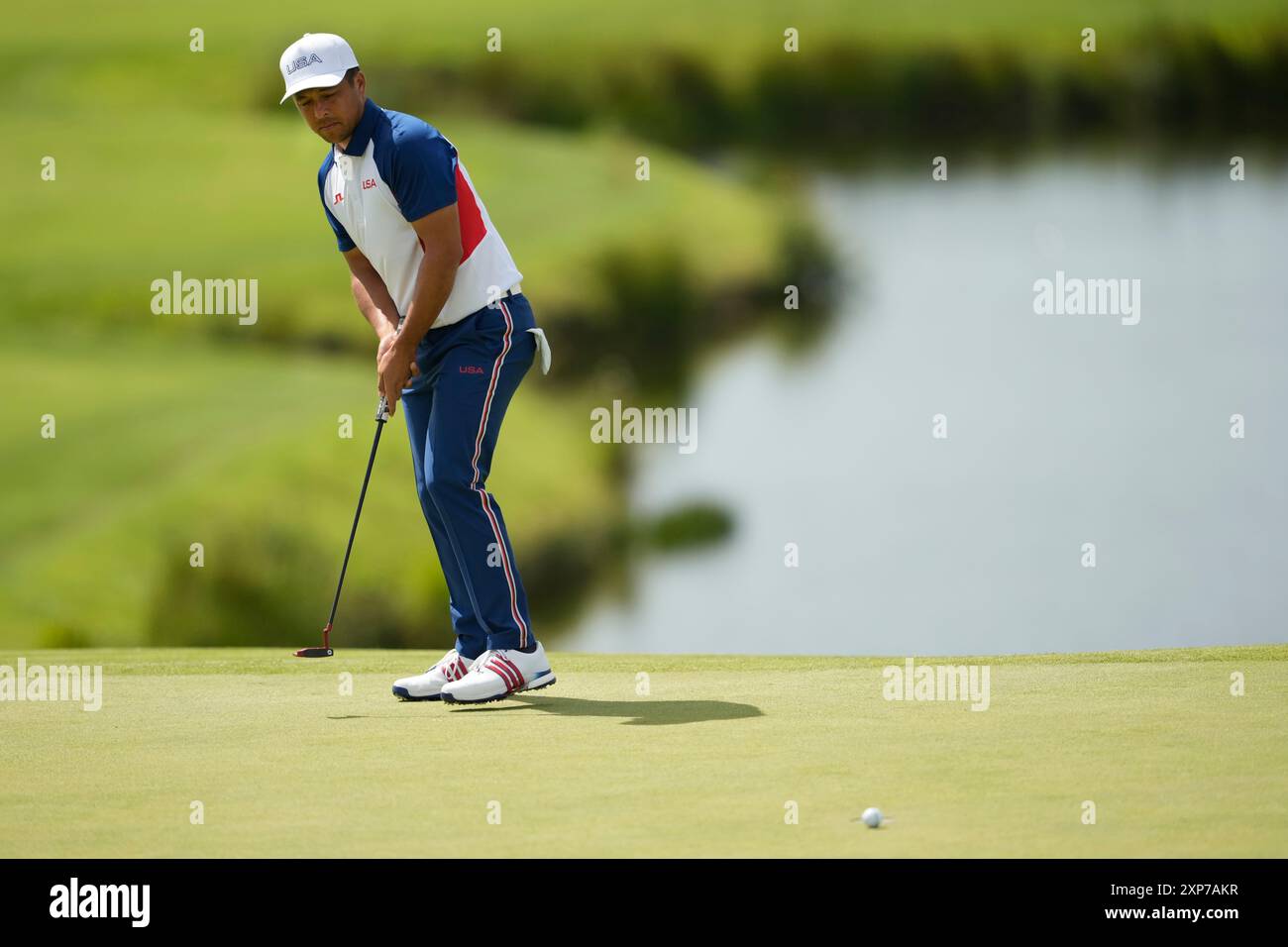 Xander Schauffele, of the United States, reacts after missing a putt on ...