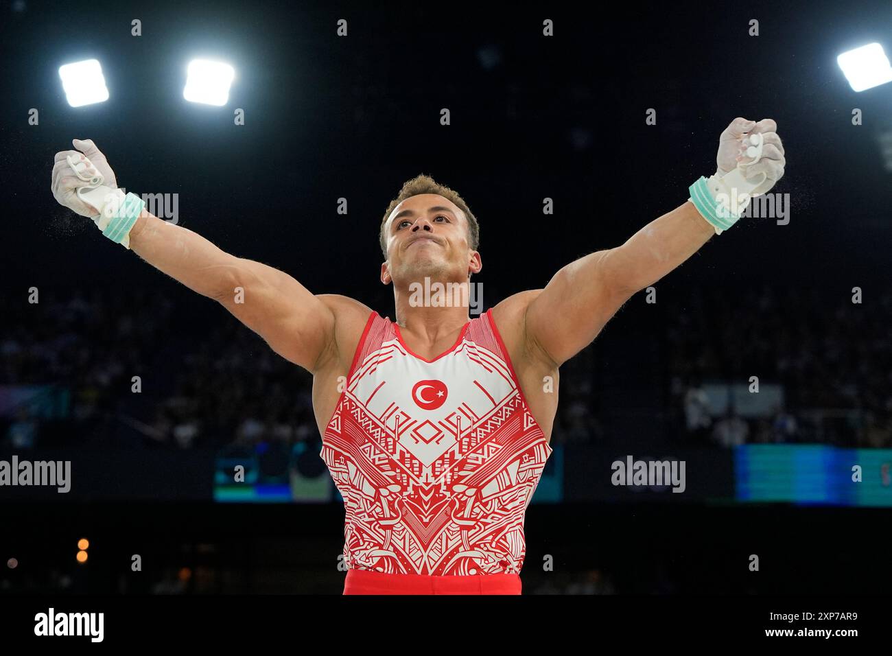 Adem Asil, of Turkey, competes during the men's artistic gymnastics ...