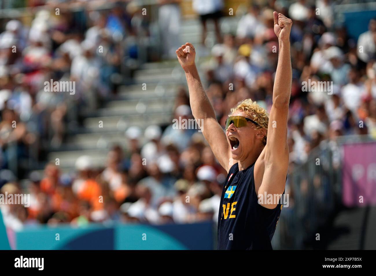 Sweden's David Ahmad celebrates in a beach volleyball match against ...