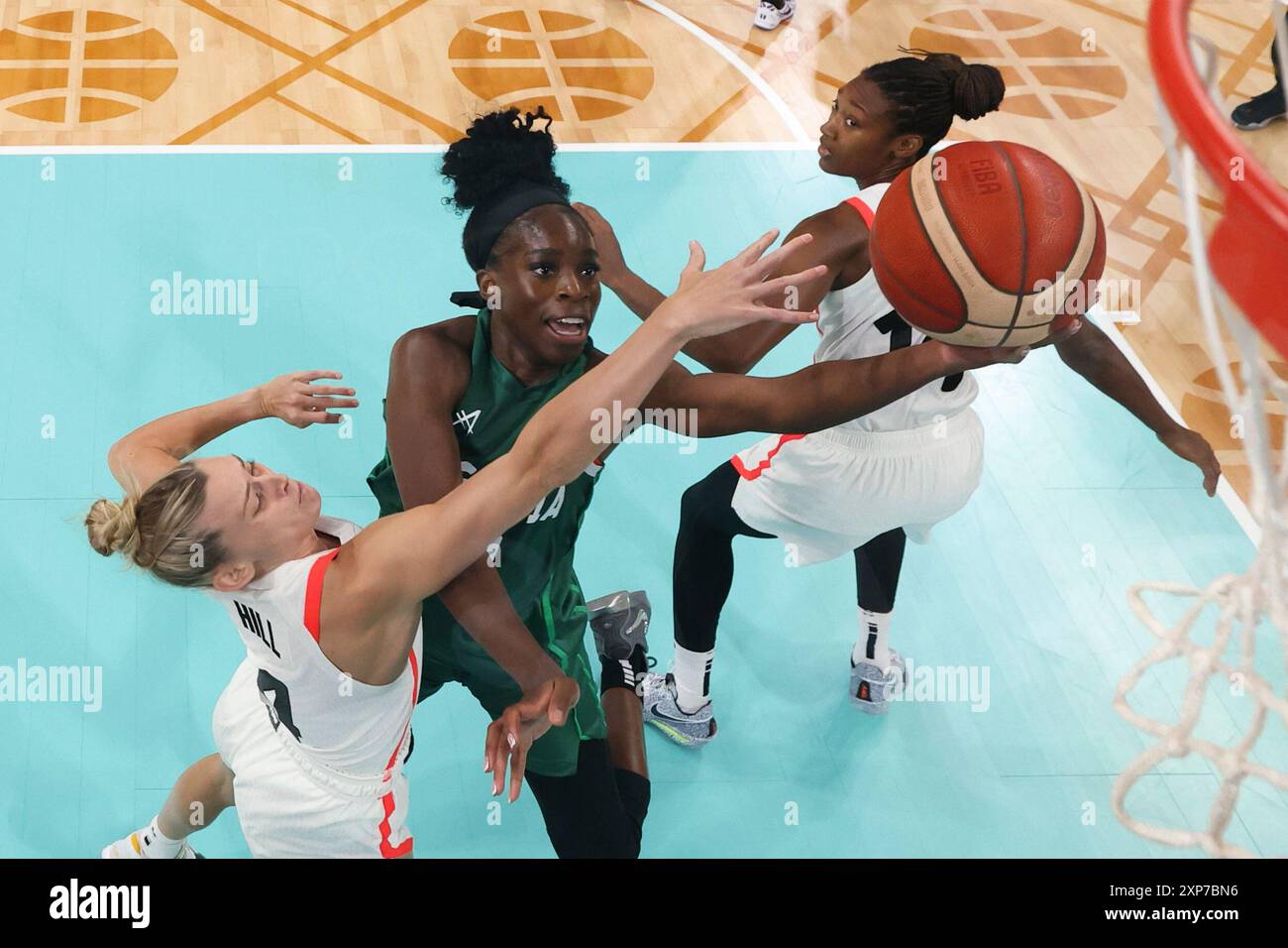 Promise Amukamara (10), of Nigeria, shoots over Sami Hill (4), of ...