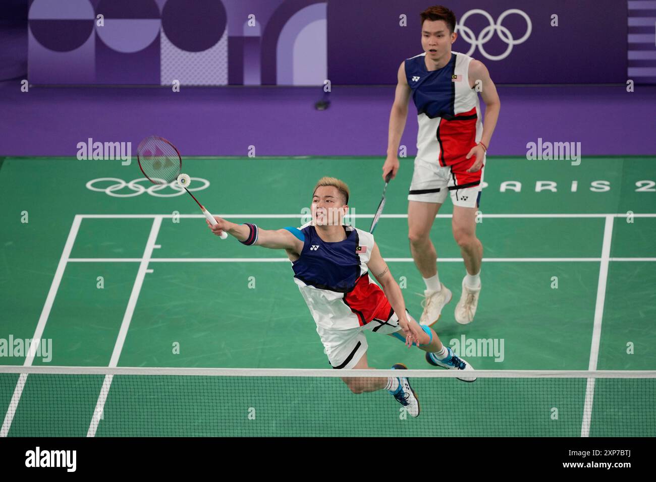 Malaysia's Aaron Chia, left, and Soh Wooi Yik play against Denmark's Kim Astrup and Anders ...