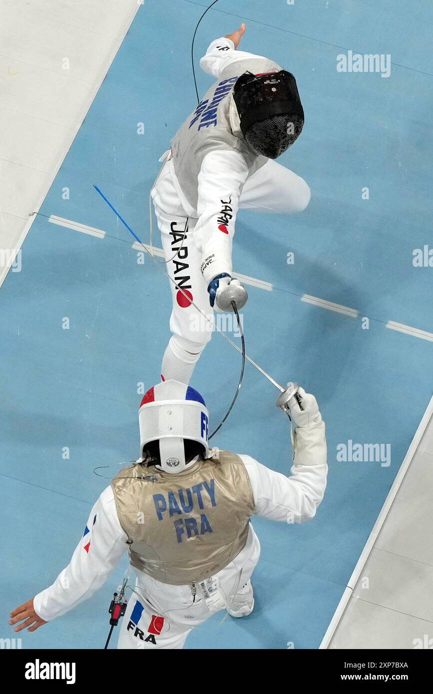 France's Maxime Pauty, top, and Japan's Takahiro Shikine compete in the ...