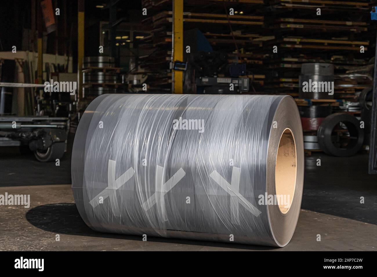 Roll of Steel metal on factory loading dock Stock Photo - Alamy