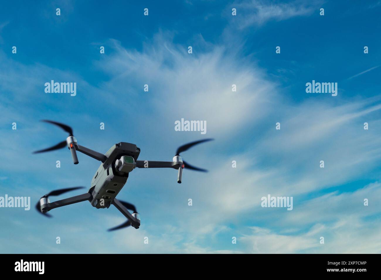 Drone flying against dark blue sky Stock Photo - Alamy