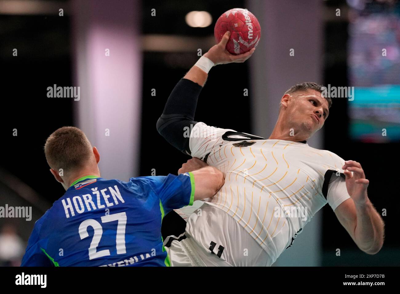 Sebastian Heymann, of Germany, attempts to score against Kristjan ...
