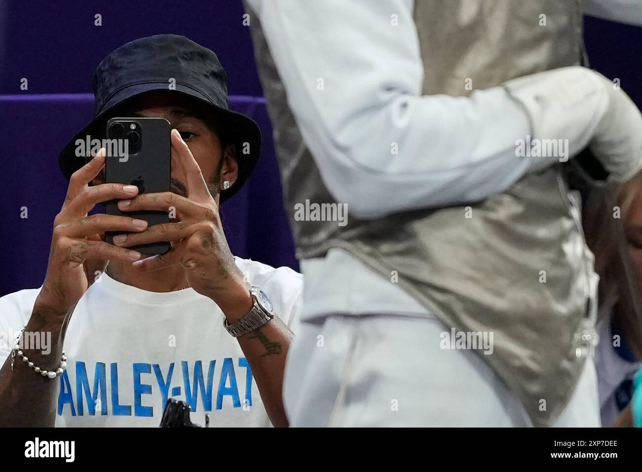 Formula one driver Lewis Hamilton attends at the men's team foil ...