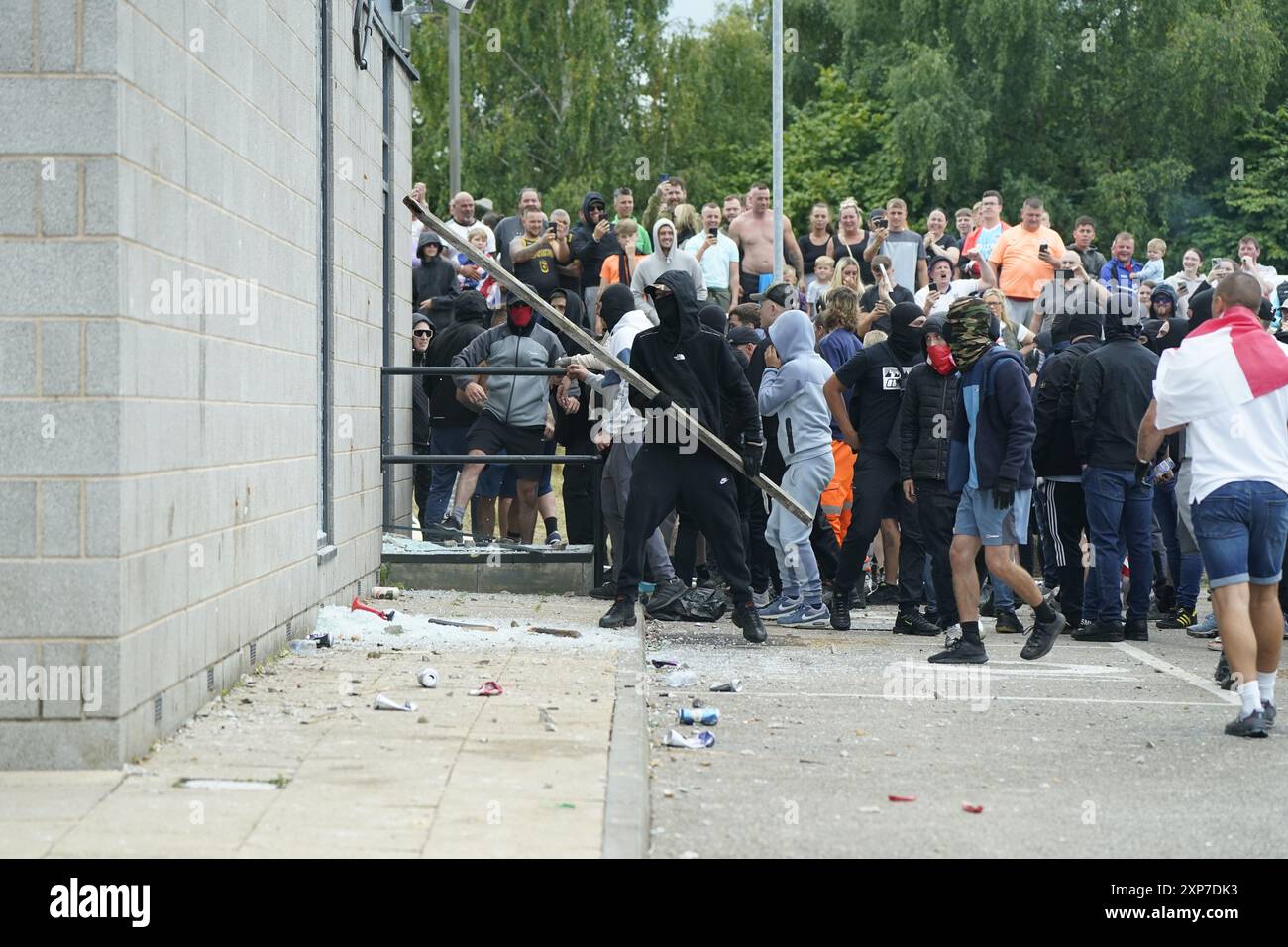 Windows are smashed as trouble flares during an anti-immigration ...