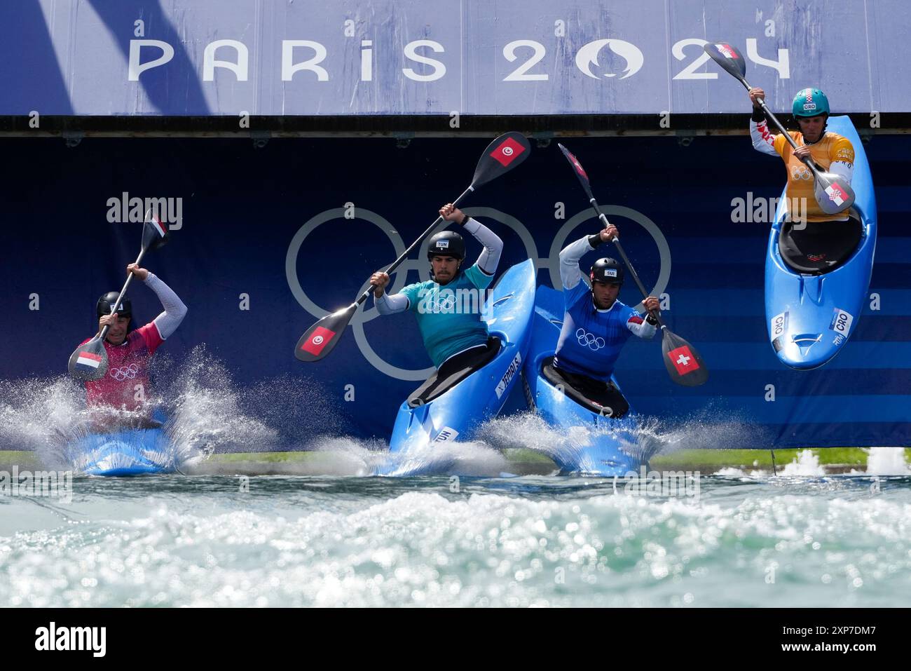 Boris Neveu of France competes in the men's kayak cross heat against ...