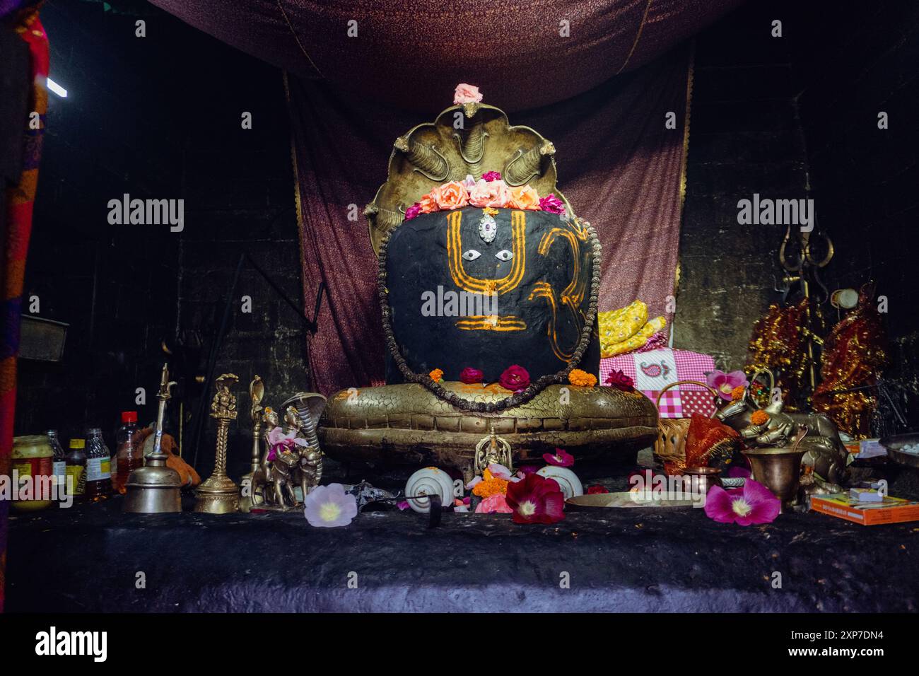 July25th2024, Himachal Pradesh, India. Black stone Shiva Lingam adorned ...