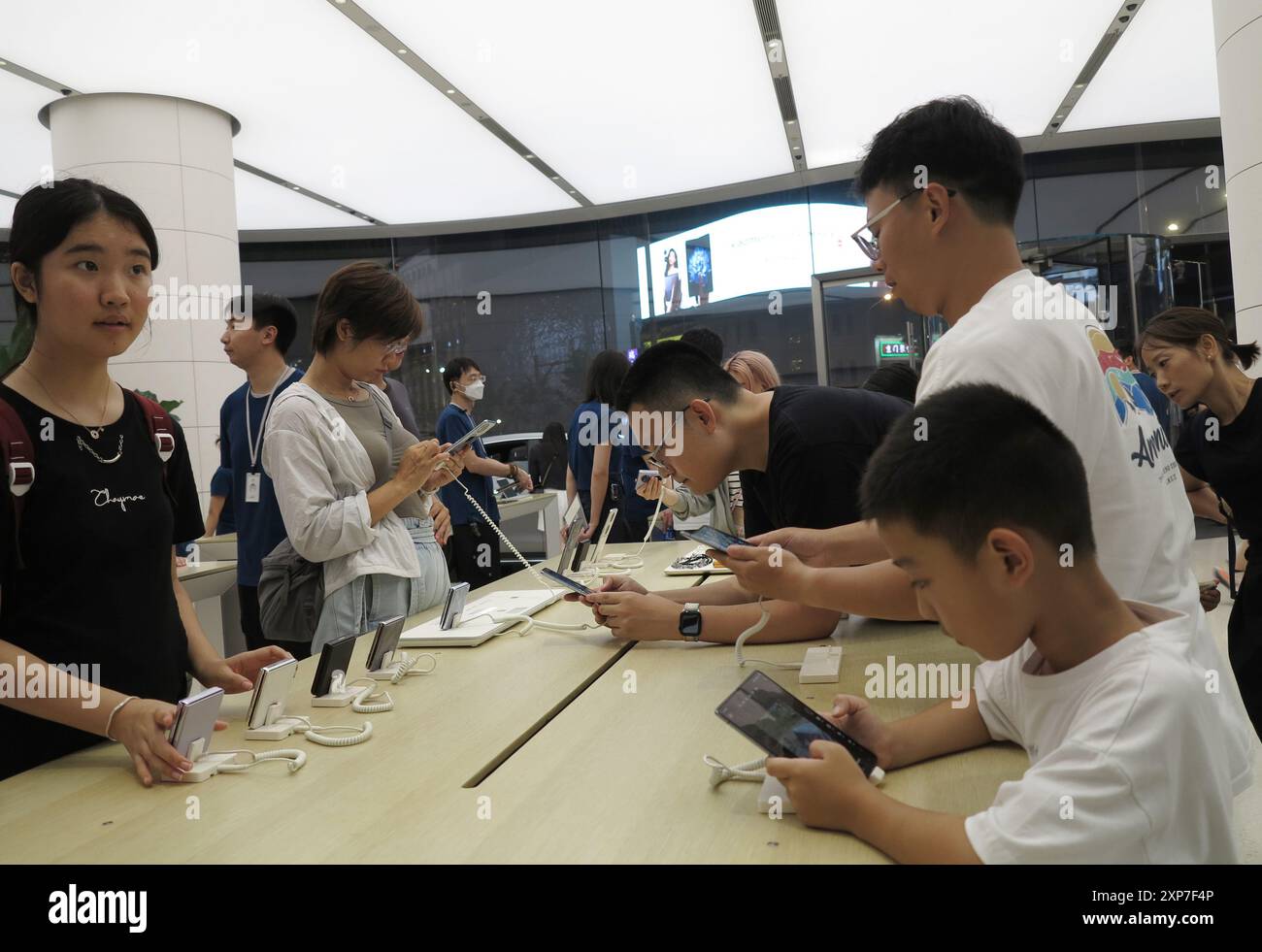 BEIJING, CHINA - AUGUST 4, 2024 - People experience Huawei mobile ...