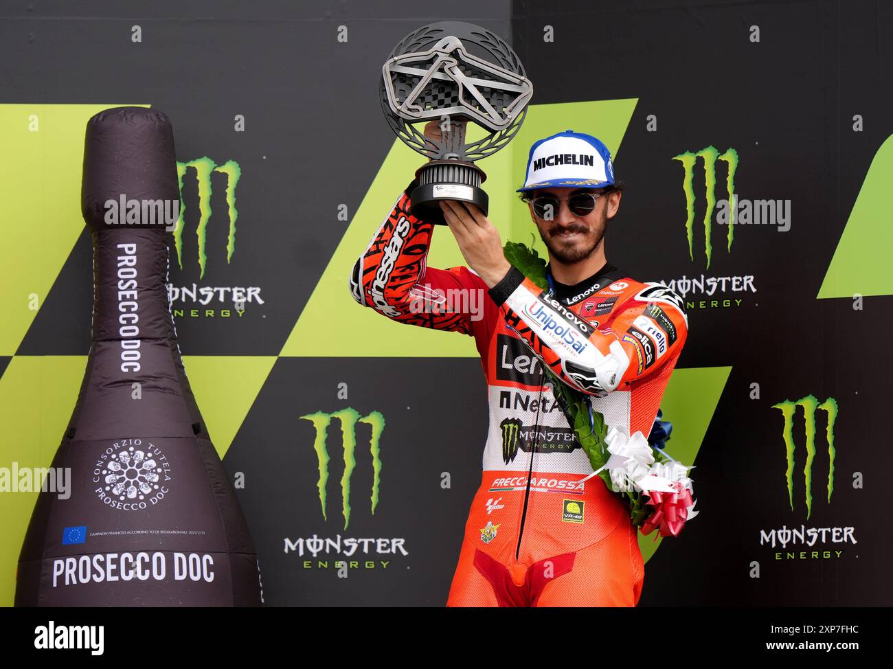 Ducati Lenovo Team's Francesco Bagnaia on the podium with his trophy ...