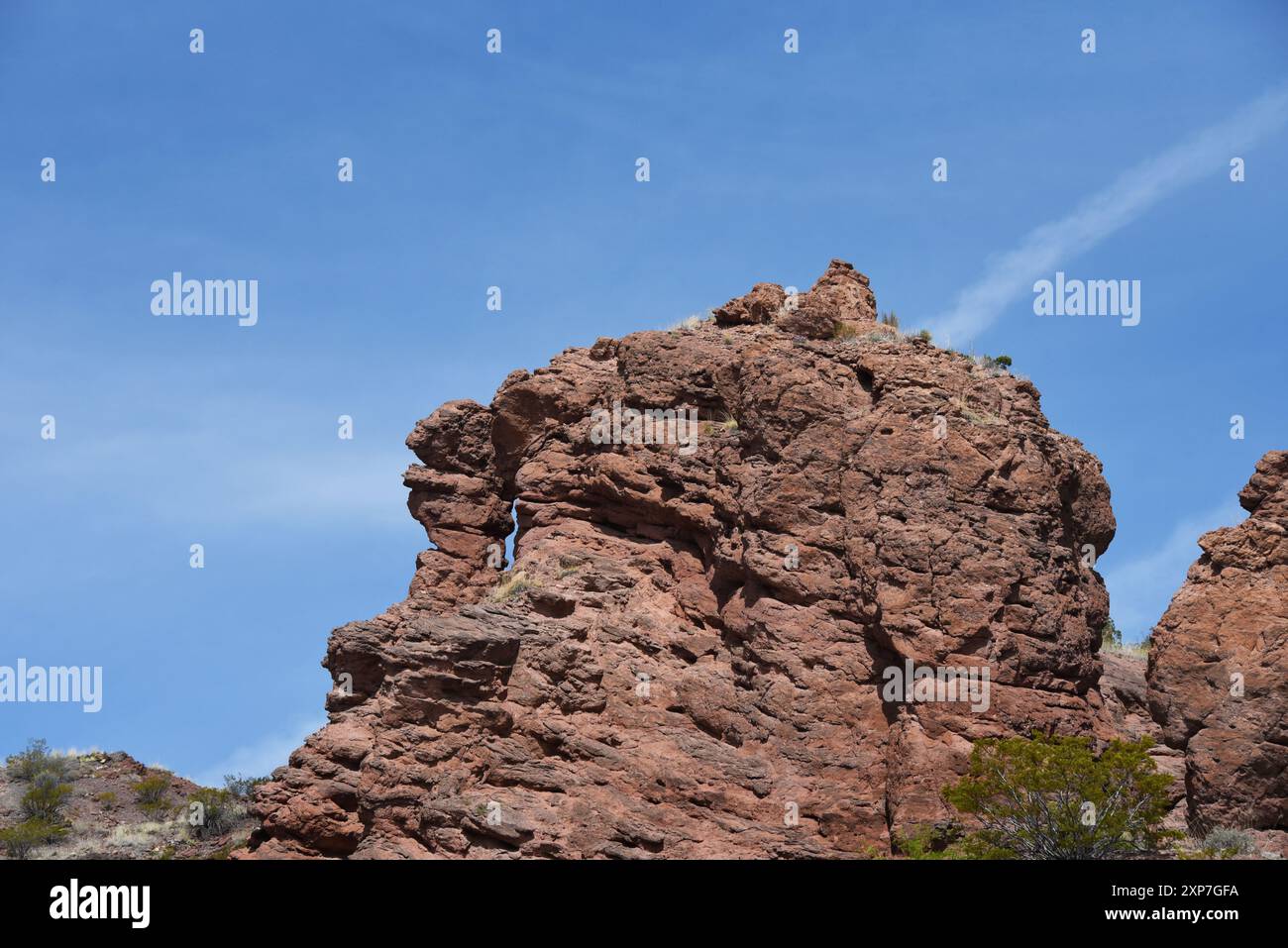 Small arch has been worn into red sandstone cliffs of San Lorenzo ...