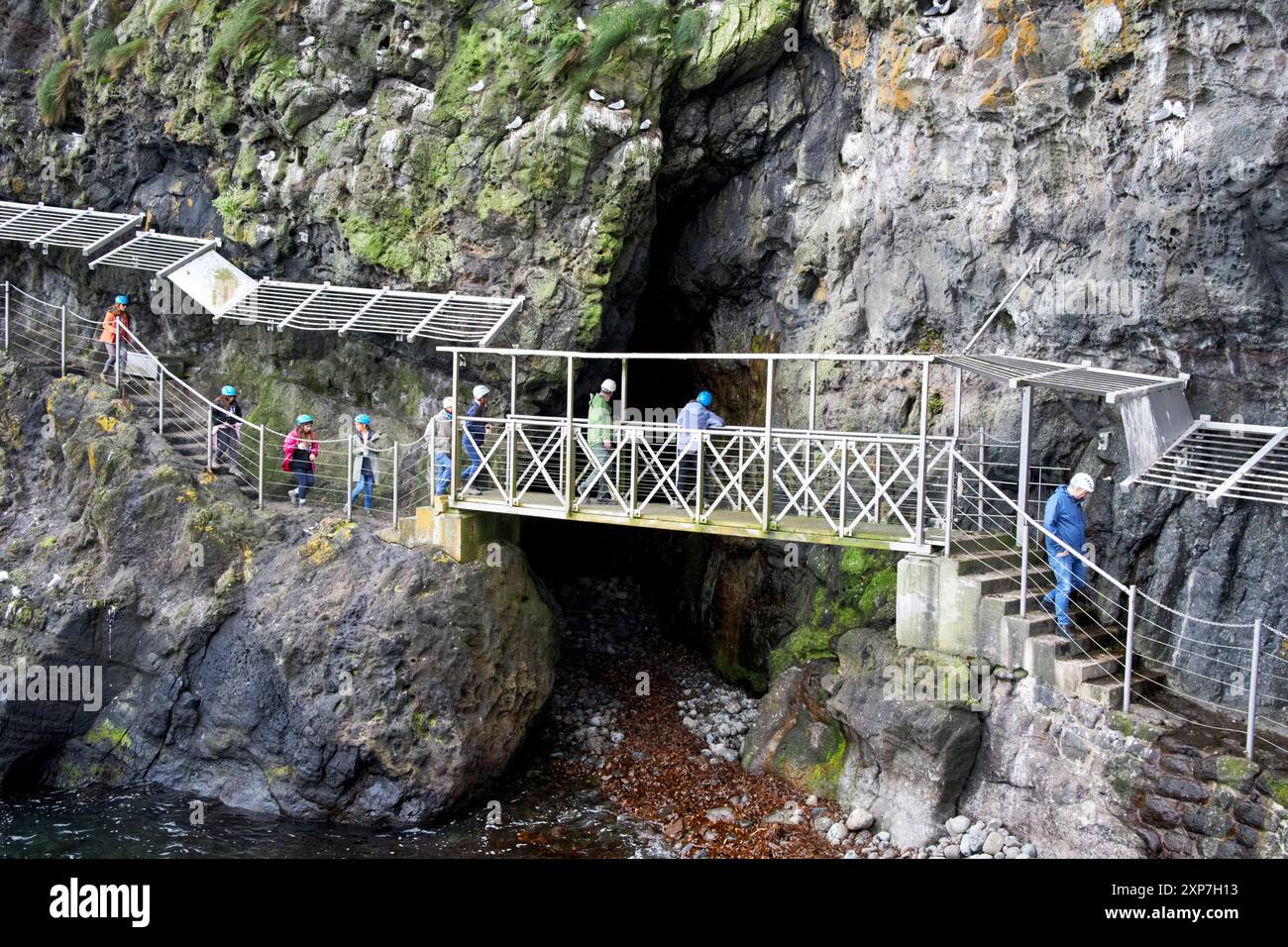 tourists on elevated walkway bridge at the spleenwort cave at the ...