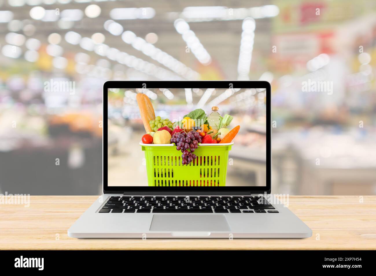 supermarket aisle blurred background with laptop computer and shopping ...