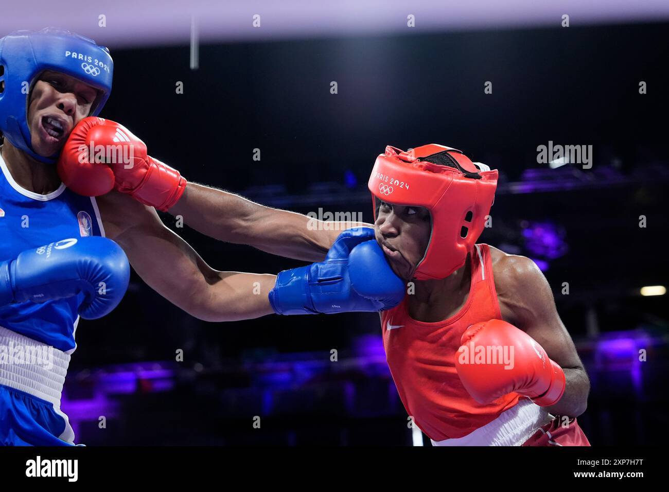 Refugee Olympic Team's Cindy Ngamba hits France's Davina Michel in ...