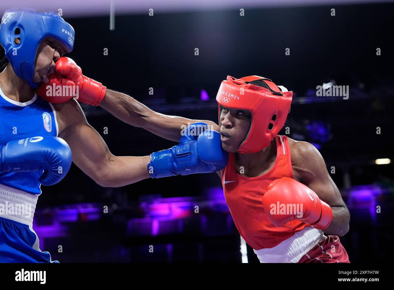 Refugee Olympic Team's Cindy Ngamba hits France's Davina Michel in ...