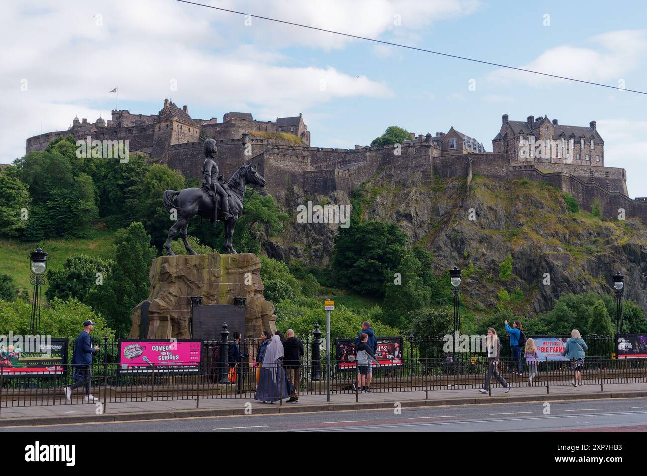 People walk by Equestrian statue by Princes Street Gardens with ...