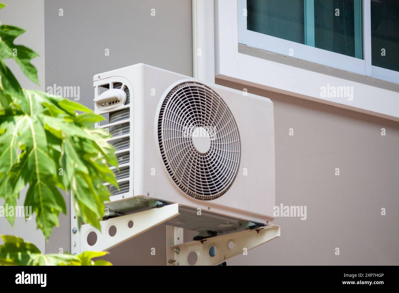 Air conditioner compressor outdoor unit installed outside the house ...