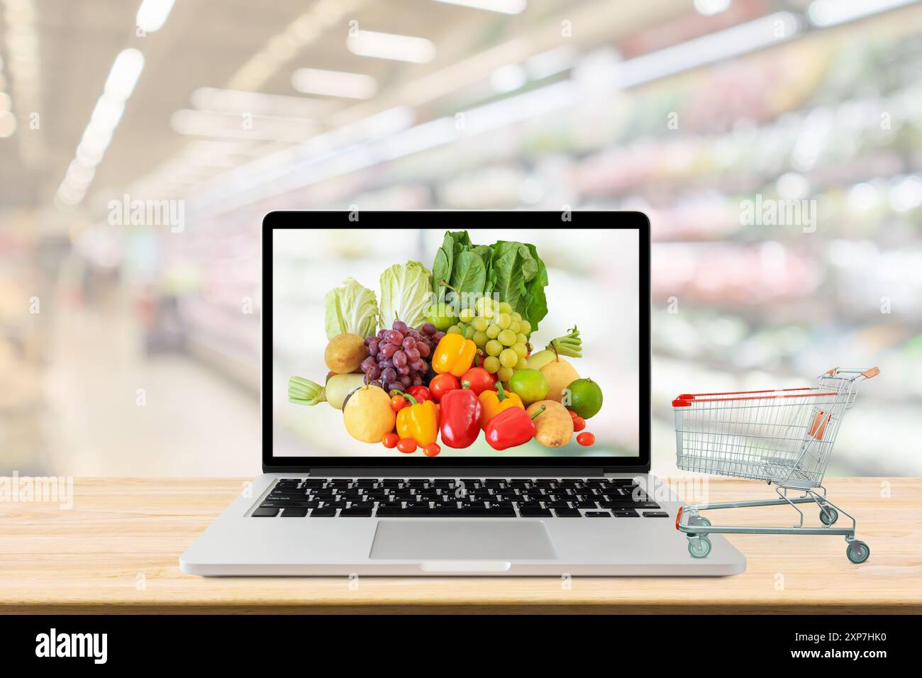 supermarket aisle blurred background with laptop computer and shopping ...